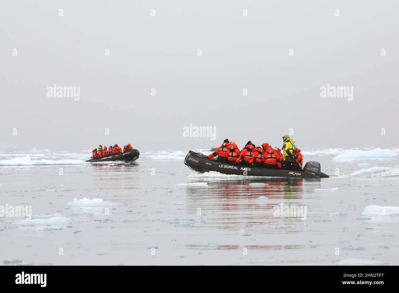 Two zodiac boats carrying cruise ship passengers from Le Boreal cruise ... Two zodiac boats carrying cruise ship passengers from Le Boreal cruise ...