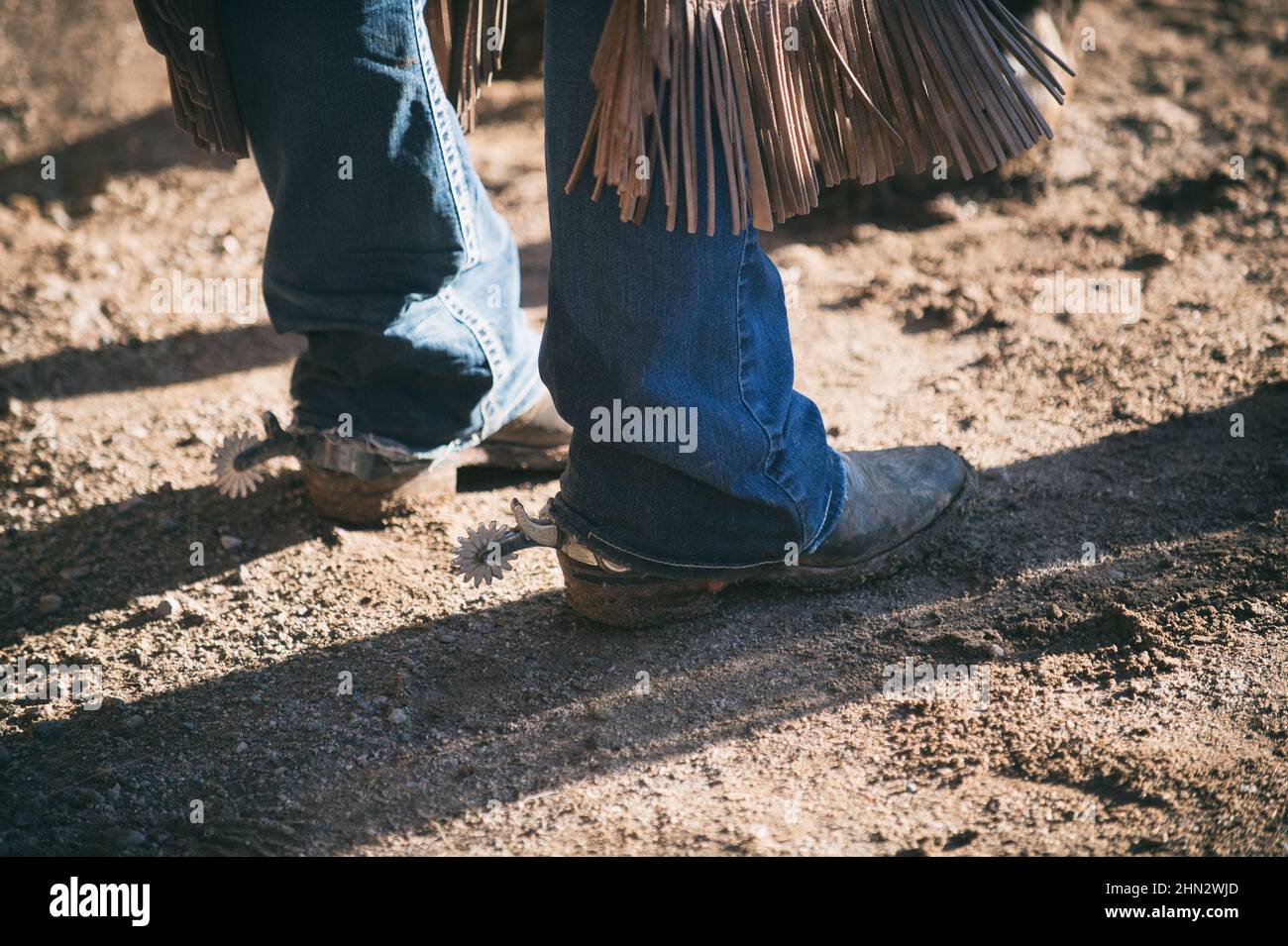Legs of cowboy showing boots with spurs and shadow of cowboy Stock ...