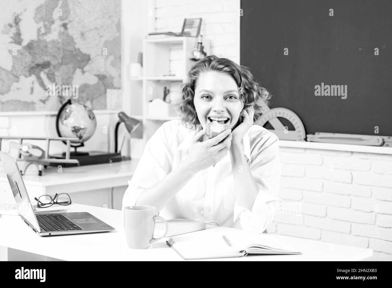 Teacher school lunch. Education. Eating in classroom. Study and ...