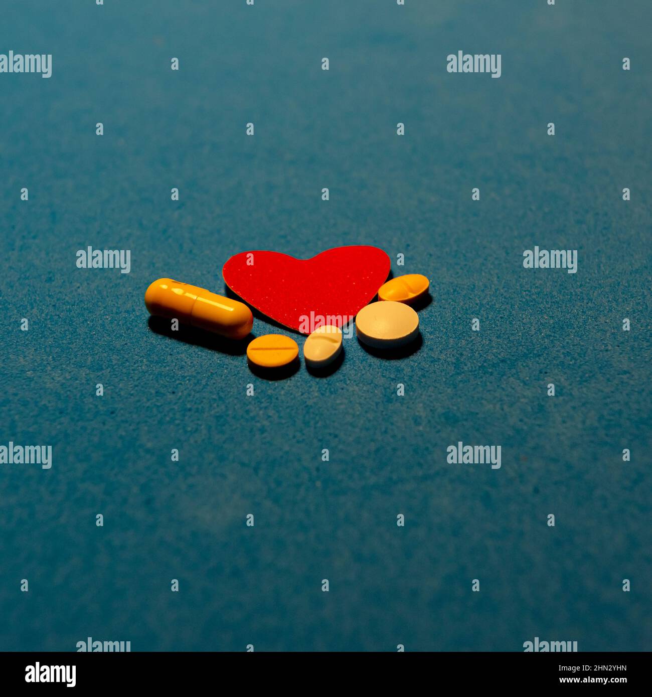 mental health pills with a red heart Stock Photo - Alamy