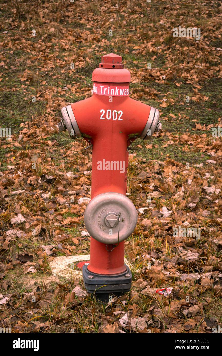 Vertical shot of a red fire hydrant Stock Photo - Alamy