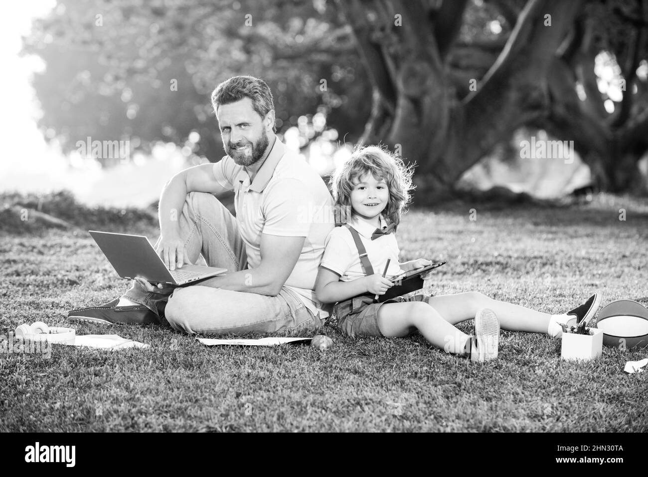 Cute family playing on computer Black and White Stock Photos & Images ...