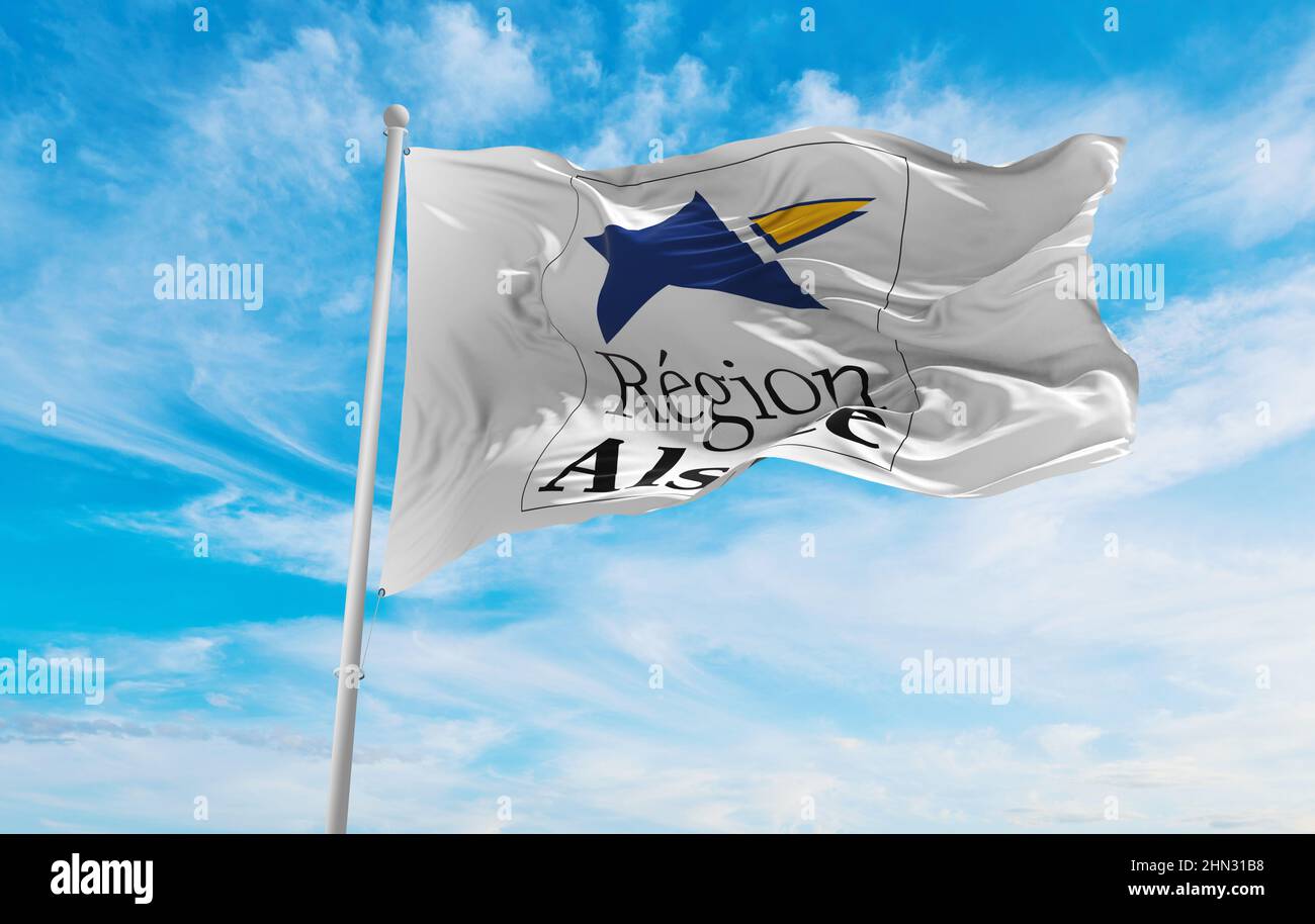 flag of former Region of Alsace, France at cloudy sky background on ...
