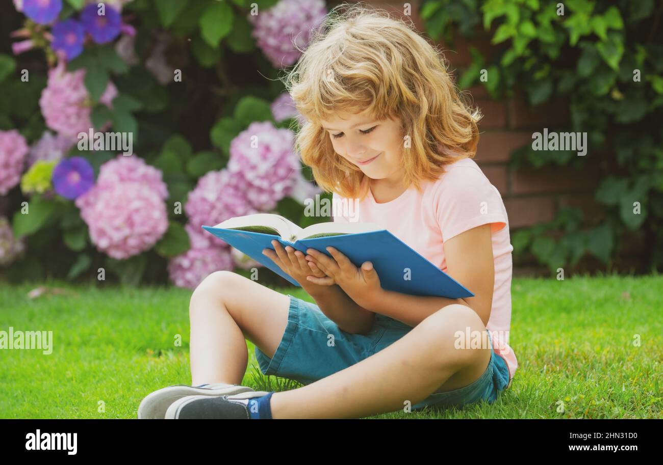 Kid read book. Child school and outdoor education. Nature and park ...