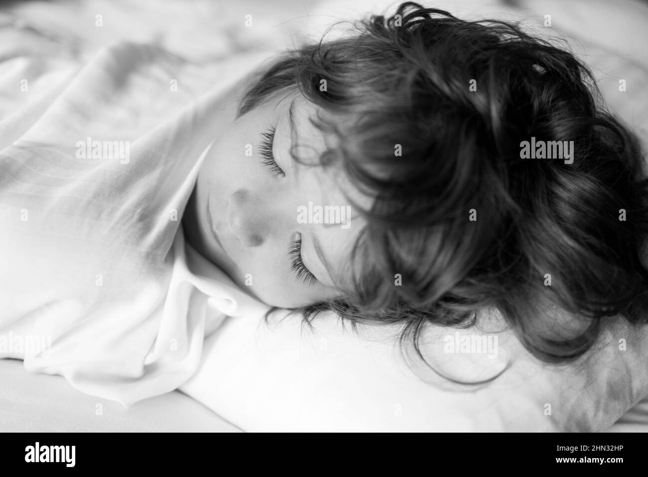 Calm adorable kids lying on soft pillows. Kids sleeping. Six years old ...