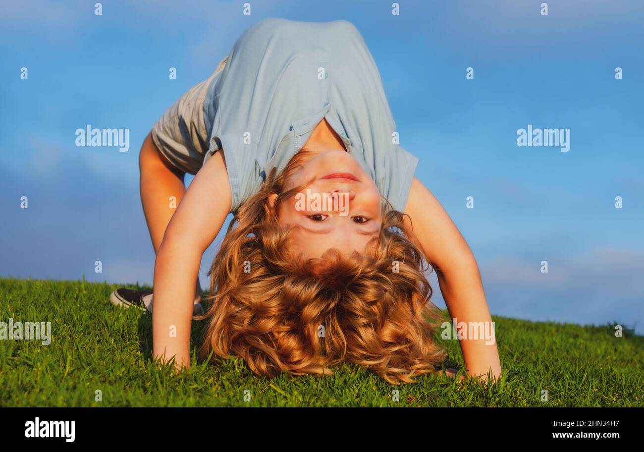 Headstand kid hi-res stock photography and images - Alamy