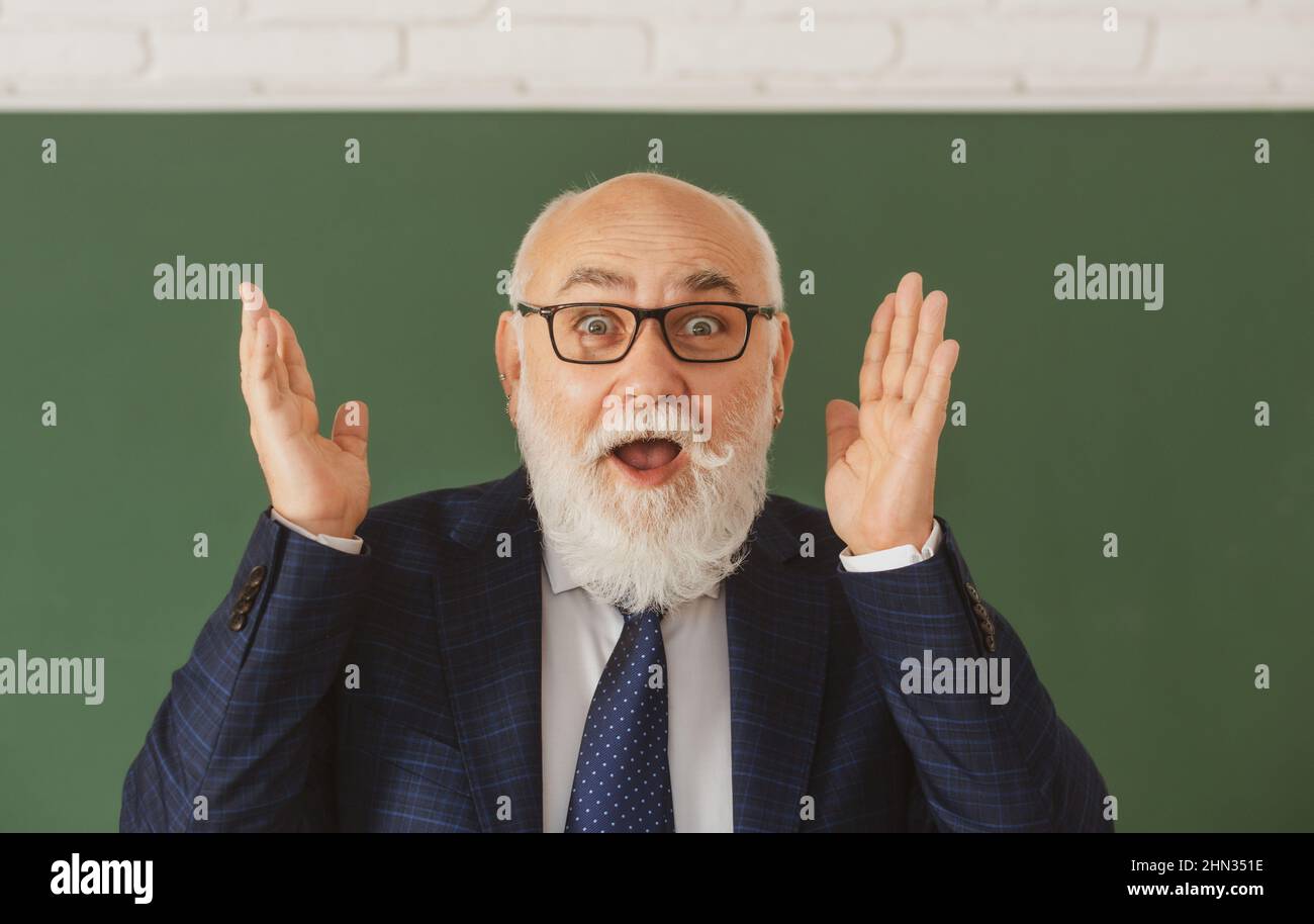 Old surprised face of funny teacher. Excited senior professor on ...