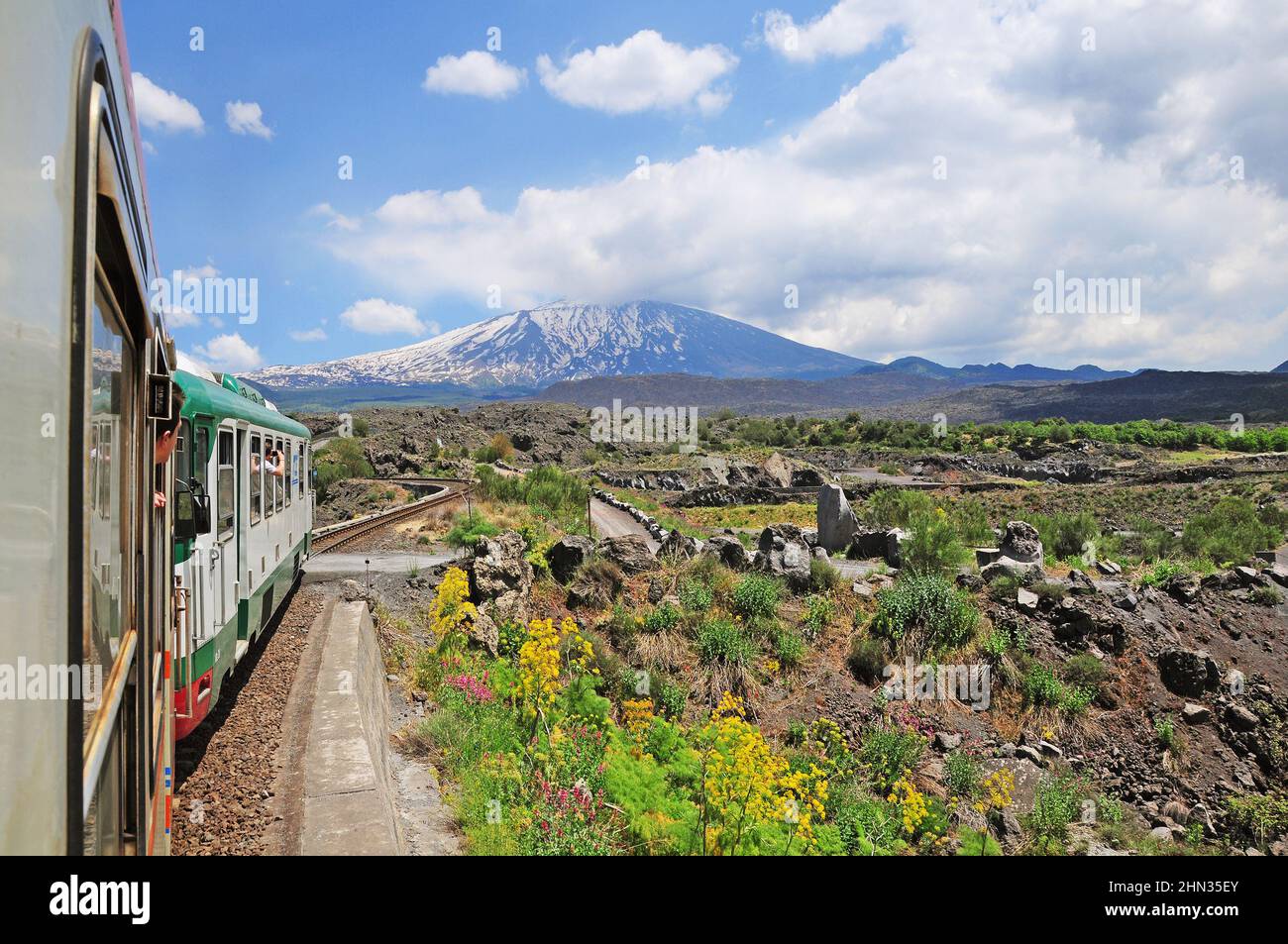 Train moves around Etna volcano. Sicily. Italy Stock Photo - Alamy
