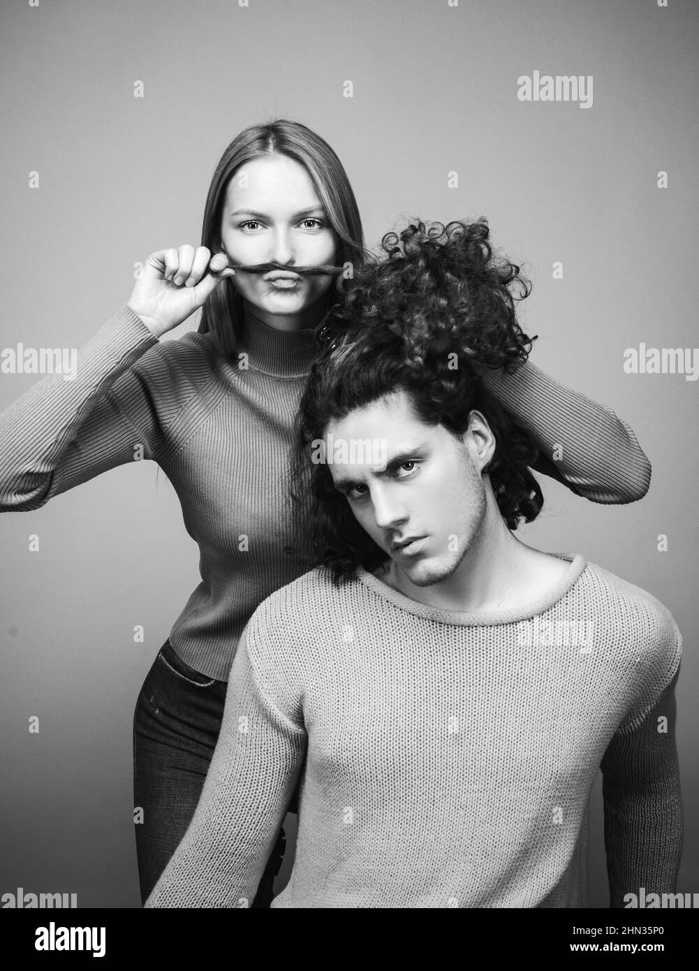 Beautiful girl playing with her boyfriend hair. Different types of hair ...