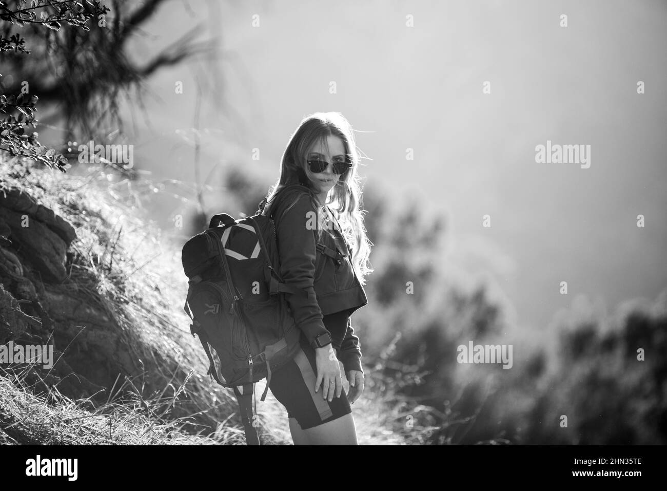 Girl hiker with backpack. Woman hiking in mountains with backpack ...