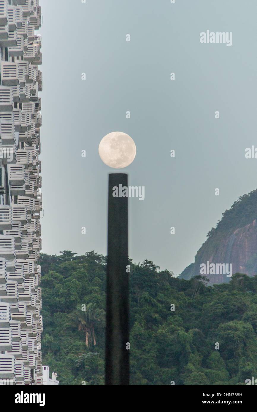 moon setting on a morning in the Copacabana neighborhood in Rio de ...