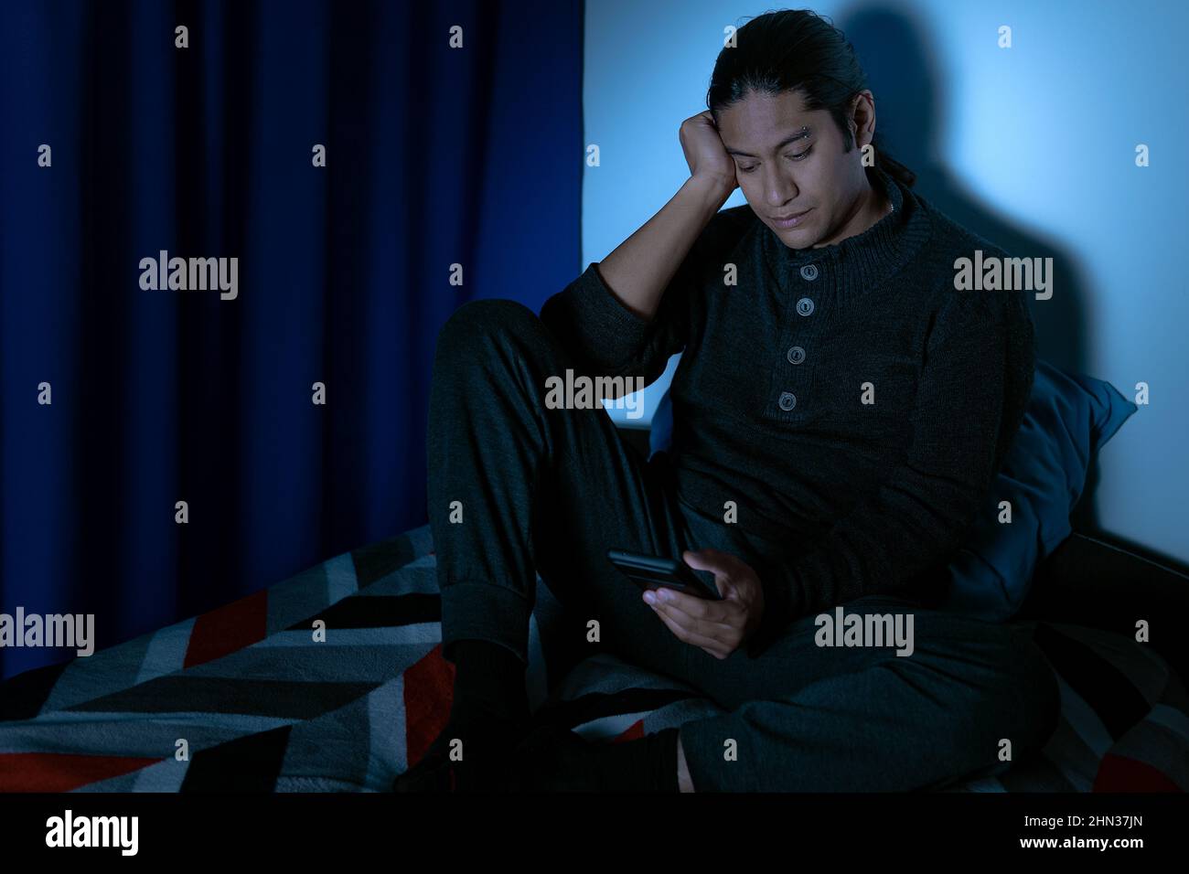 Insomnia, Depressed man sitting up in bed at night, he can't sleep from ...