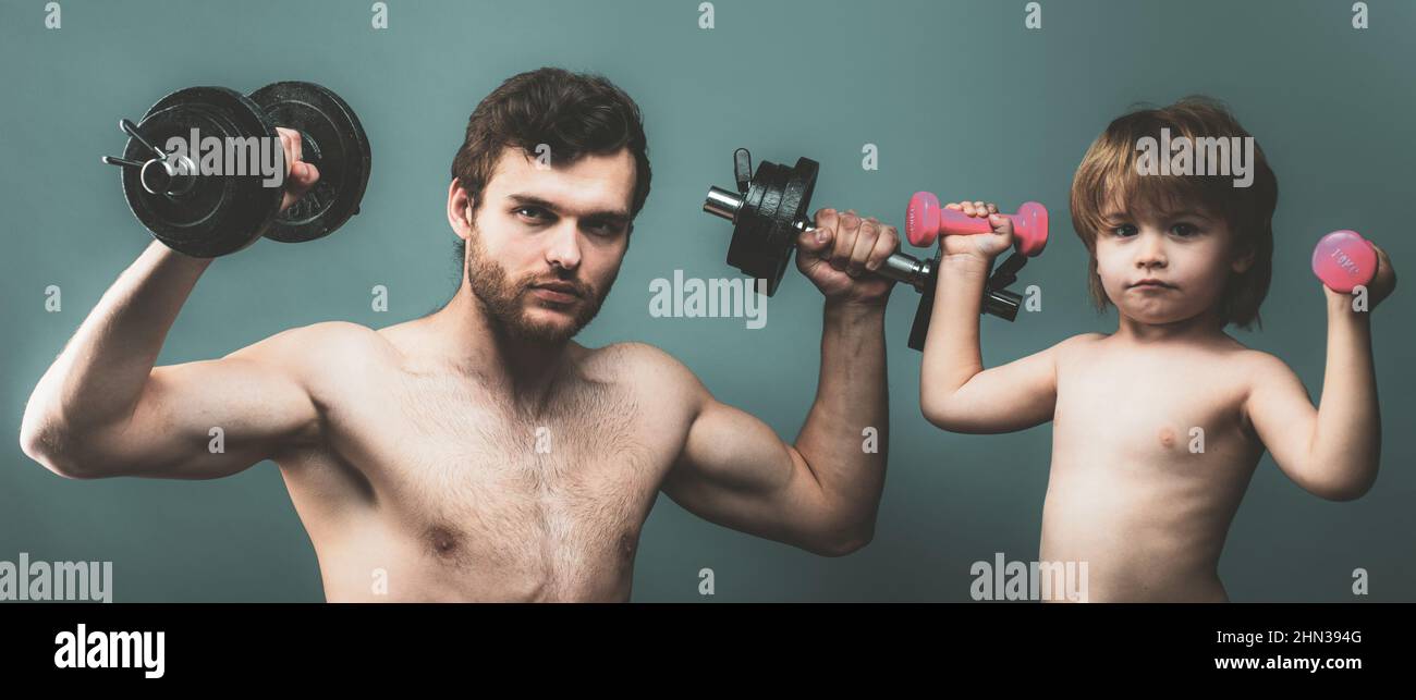 Brothers with dumbbells exercise workout on gray background. Portrait ...
