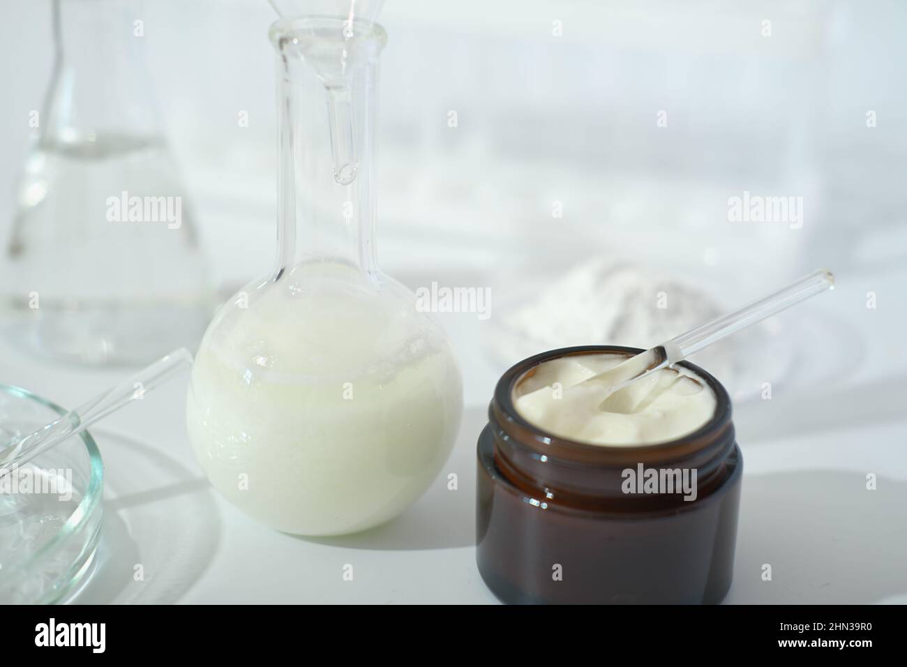 laboratory dishes and glassware on a lab table. fermentation, fermented ...