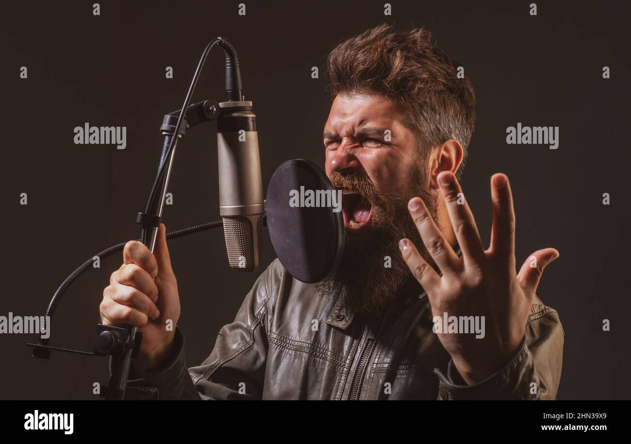 Handsome man in recording studio. Music performance vocal. Singer ...