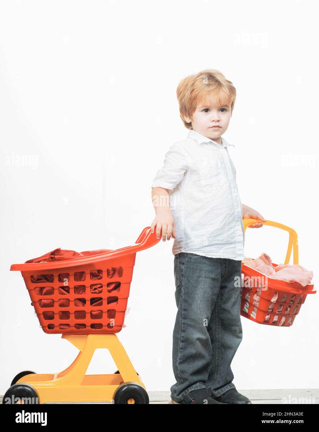 Cute buyer customer client hold shopping cart. Kids store. Boy child ...