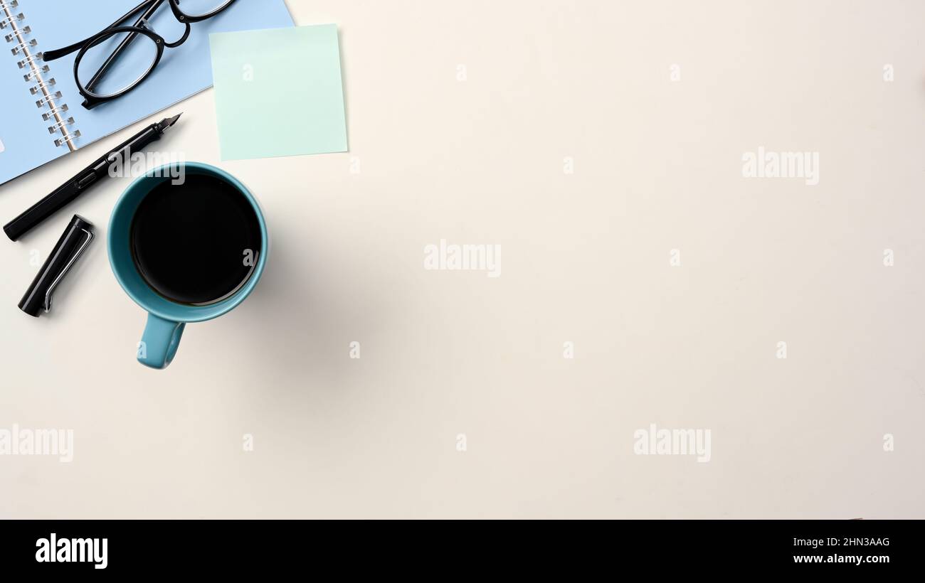 Top view workspace with blue accessories and copy space on white ...