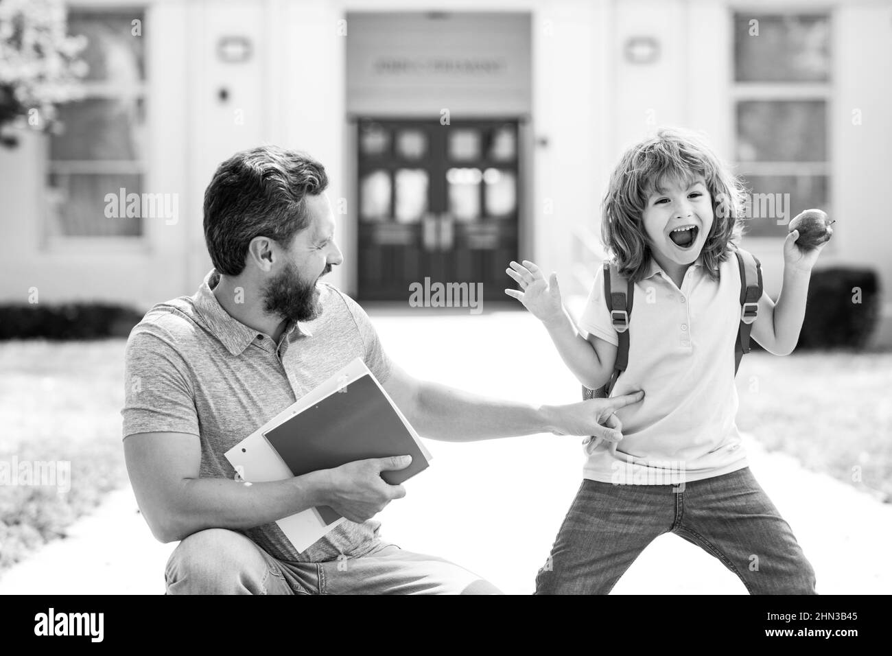 Father walking son to school. Parent and pupil of primary school ...