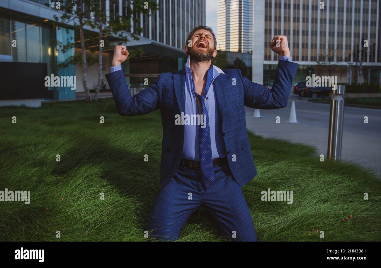 Business man crying in depression sitting on ground street suffering ...