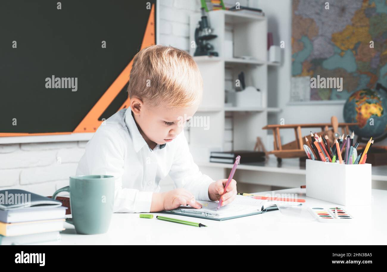 After school teaching. Happy school kids at lesson. Child tutoring ...