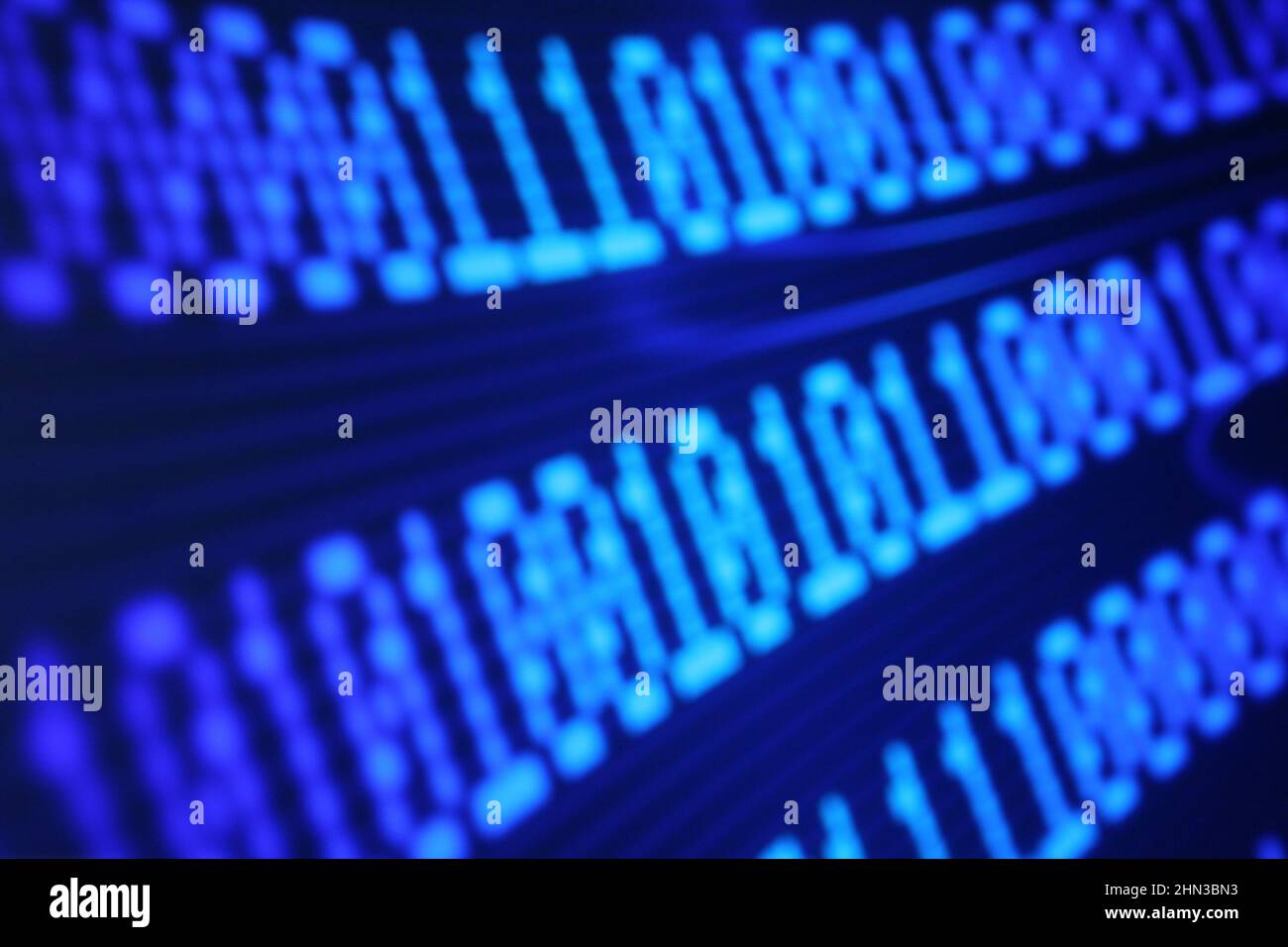 Illustration of running binary codes on a blue blurry background Stock Photo - Alamy