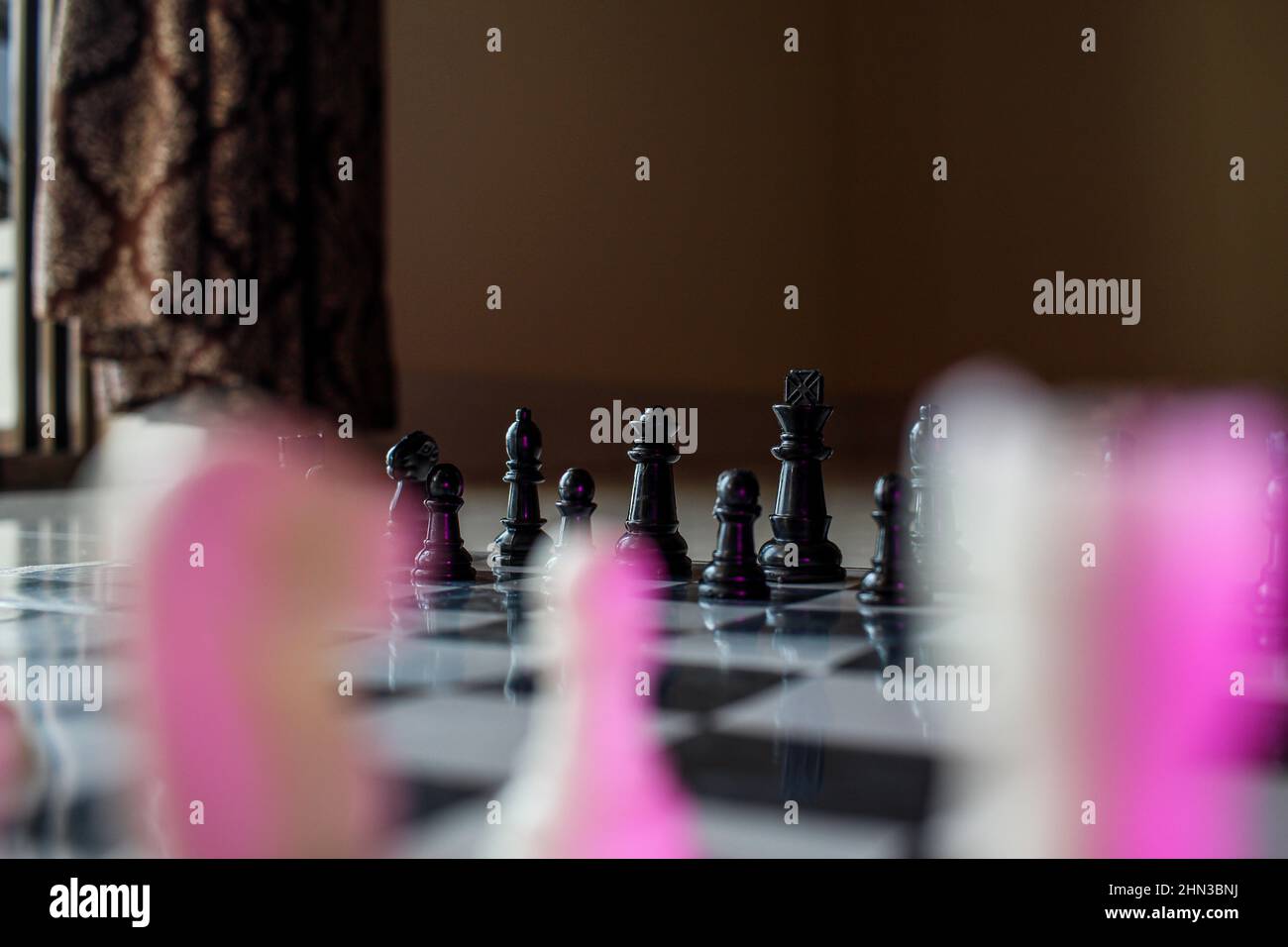 Selective focus of chess pieces on the chessboard on the table with a ...