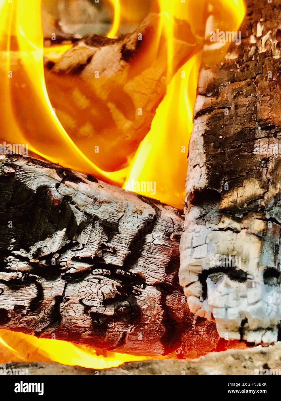 Vertical shot of a pile of burning tree logs - perfect for wallpapers ...
