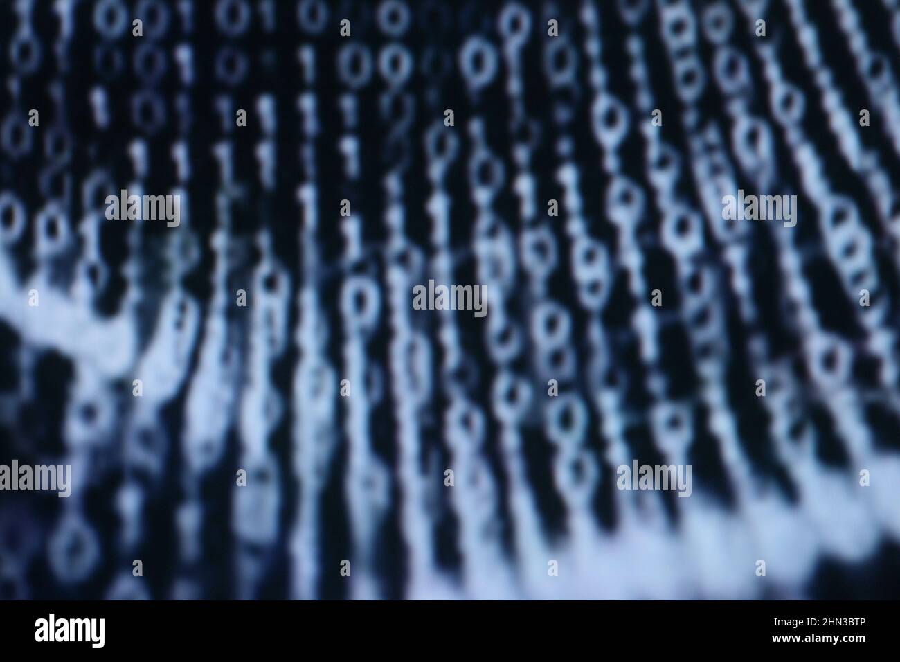 Illustration of running binary codes on a dark blurry background Stock Photo - Alamy