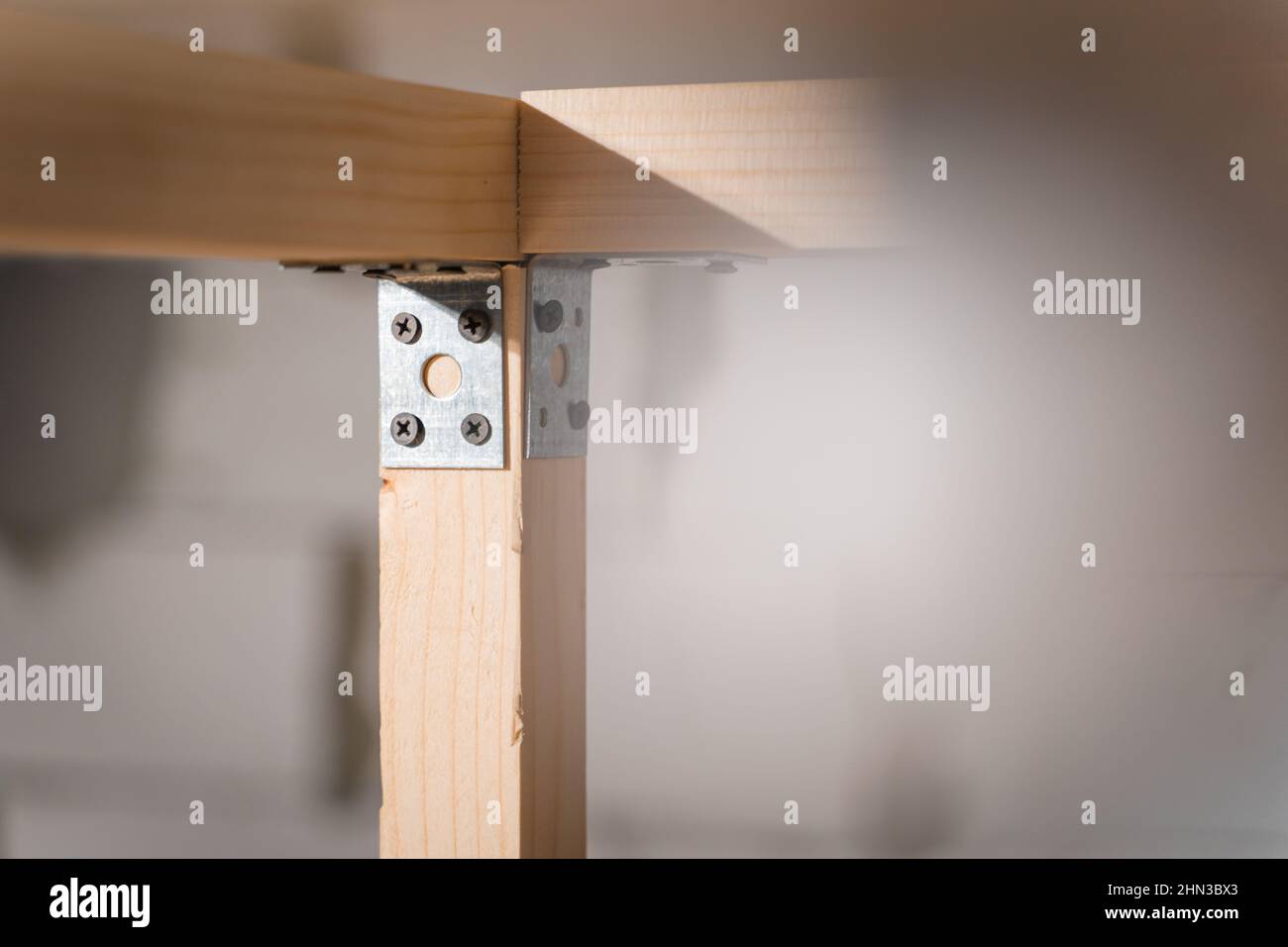 Corner connection of wooden bars with iron corners and black self ...