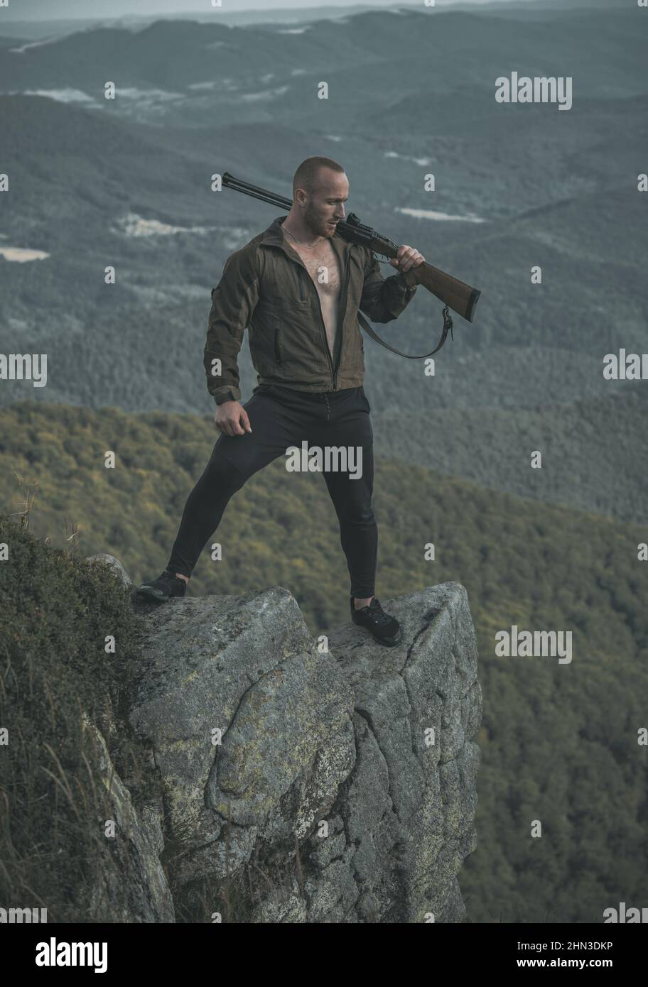 Wildlife Hunting. Hunter with shotgun gun after a hunt. Hunter with his ...