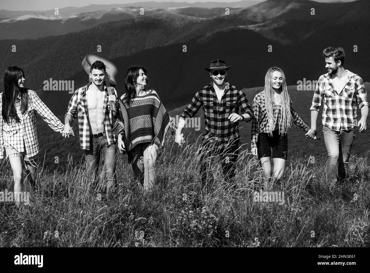 Group of young people walking on summer nature outdoor. Groups of ...