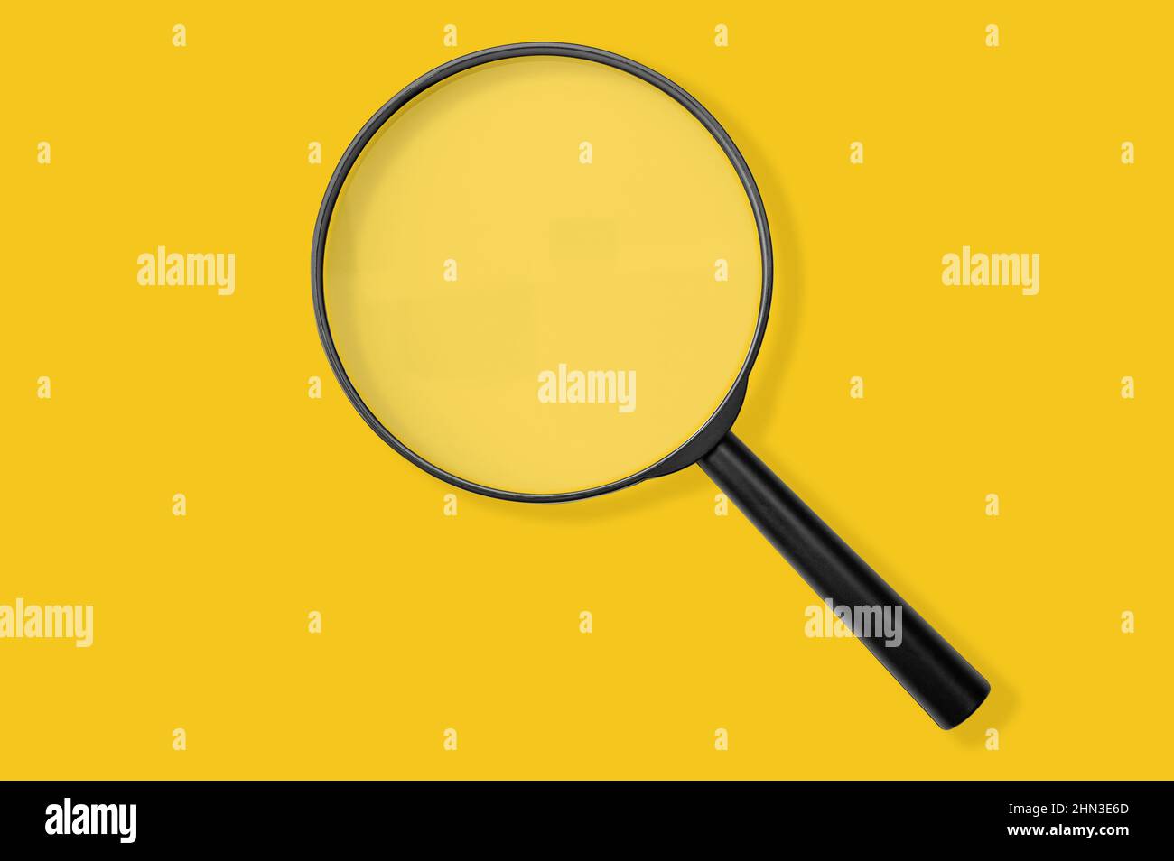 Magnifying glass black color isolated on yellow. Research, searching ...