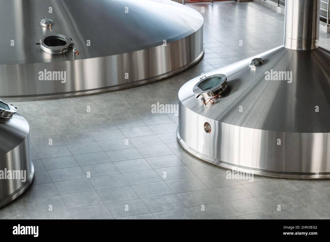 Mash vats of a brewery. Large metal fermentation tanks Stock Photo - Alamy