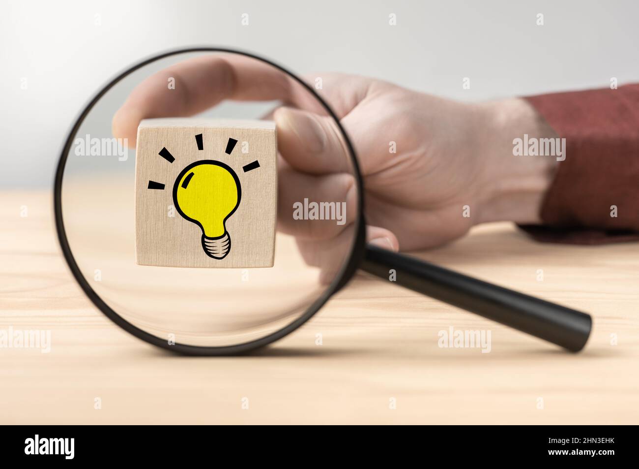 Magnifying glass with light bulb icon. Concept creative idea and ...
