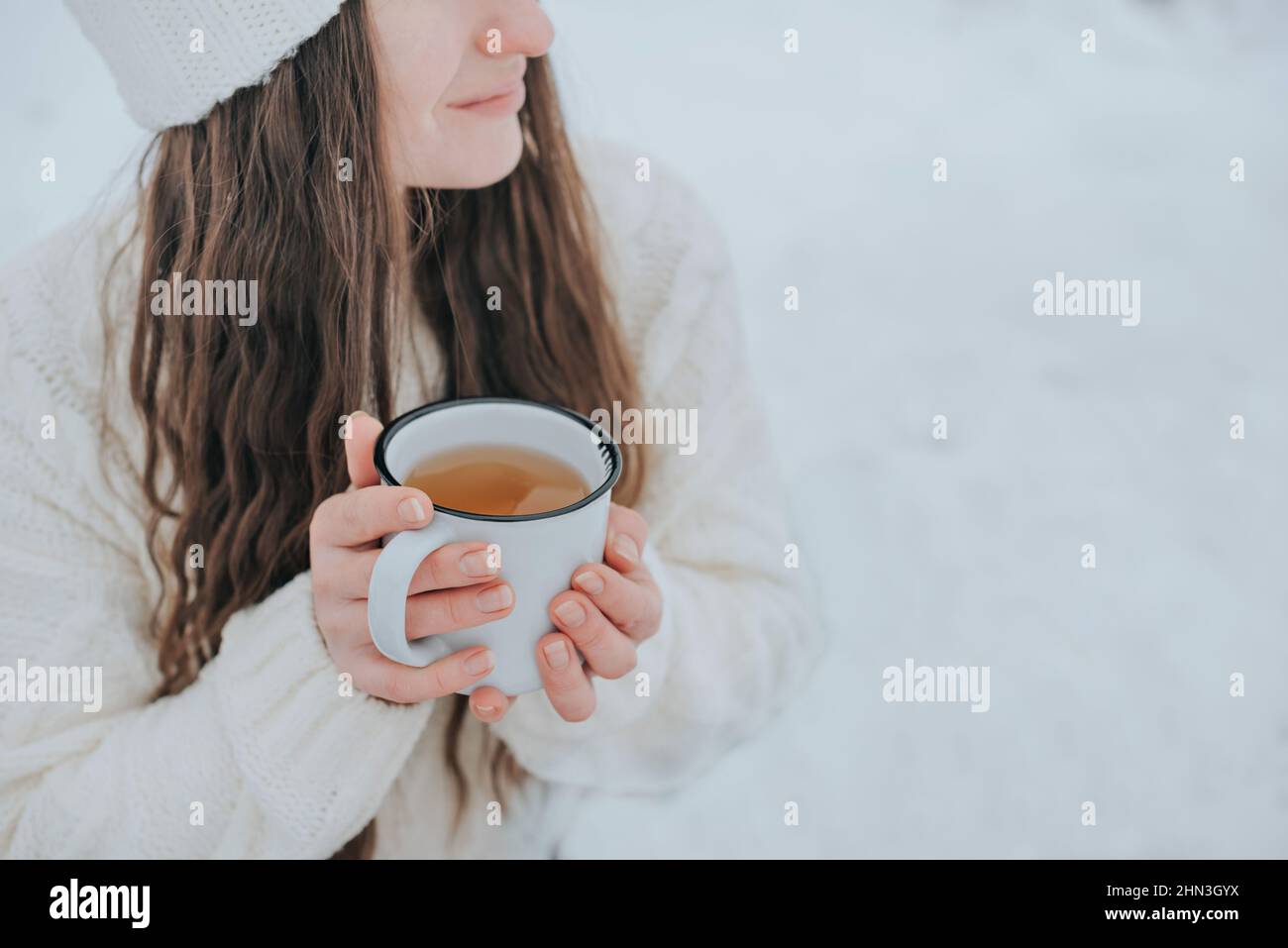 Female hands hold a drink in a white mug Stock Photo - Alamy