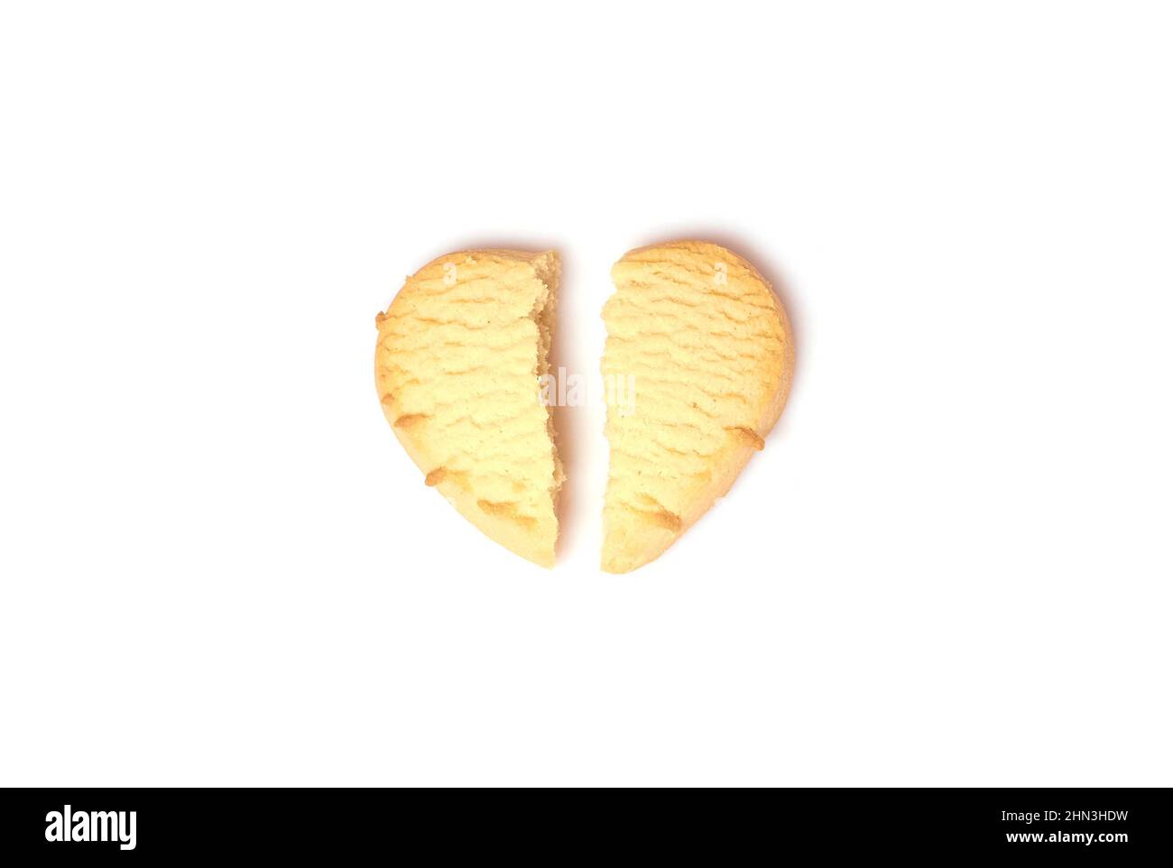 A broken heart. Lemon cookies in the shape of a heart, broken in half ...