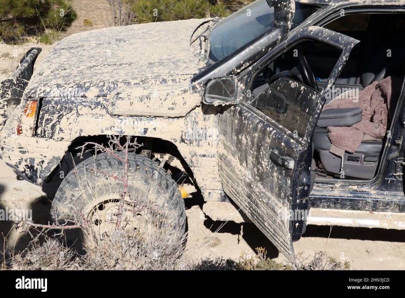 Off-road vehicle in muddy terrain Stock Photo - Alamy