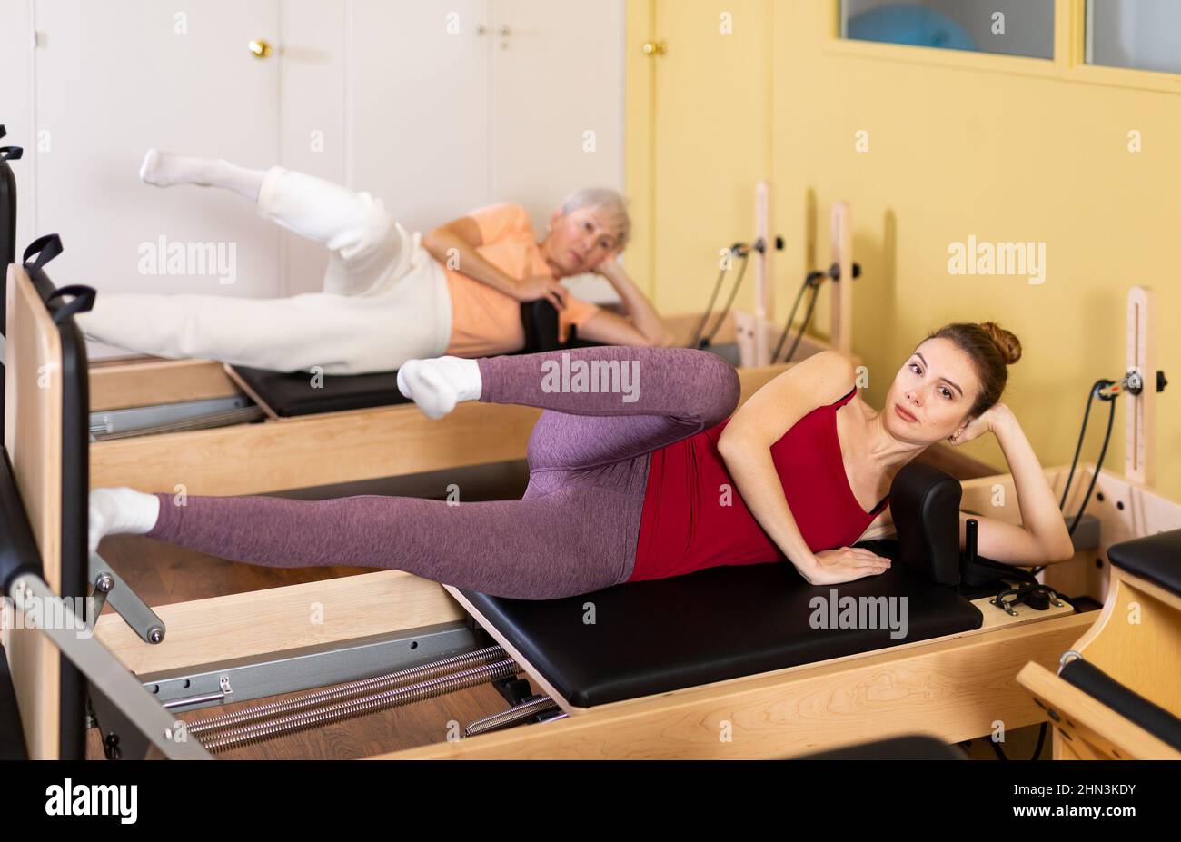 Active women perform a stretching exercise Stock Photo - Alamy
