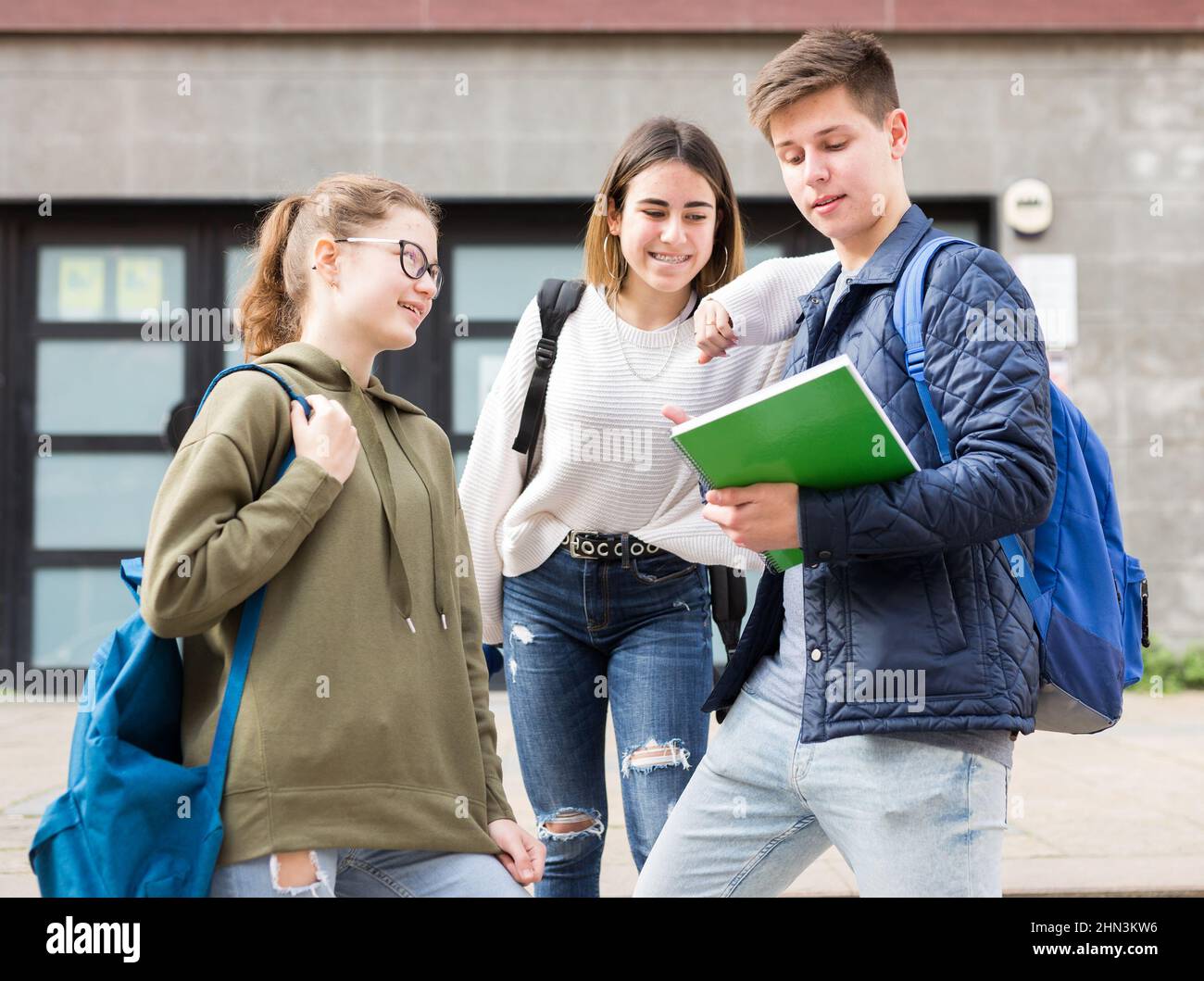Teenage students talking outside after lessons Stock Photo - Alamy