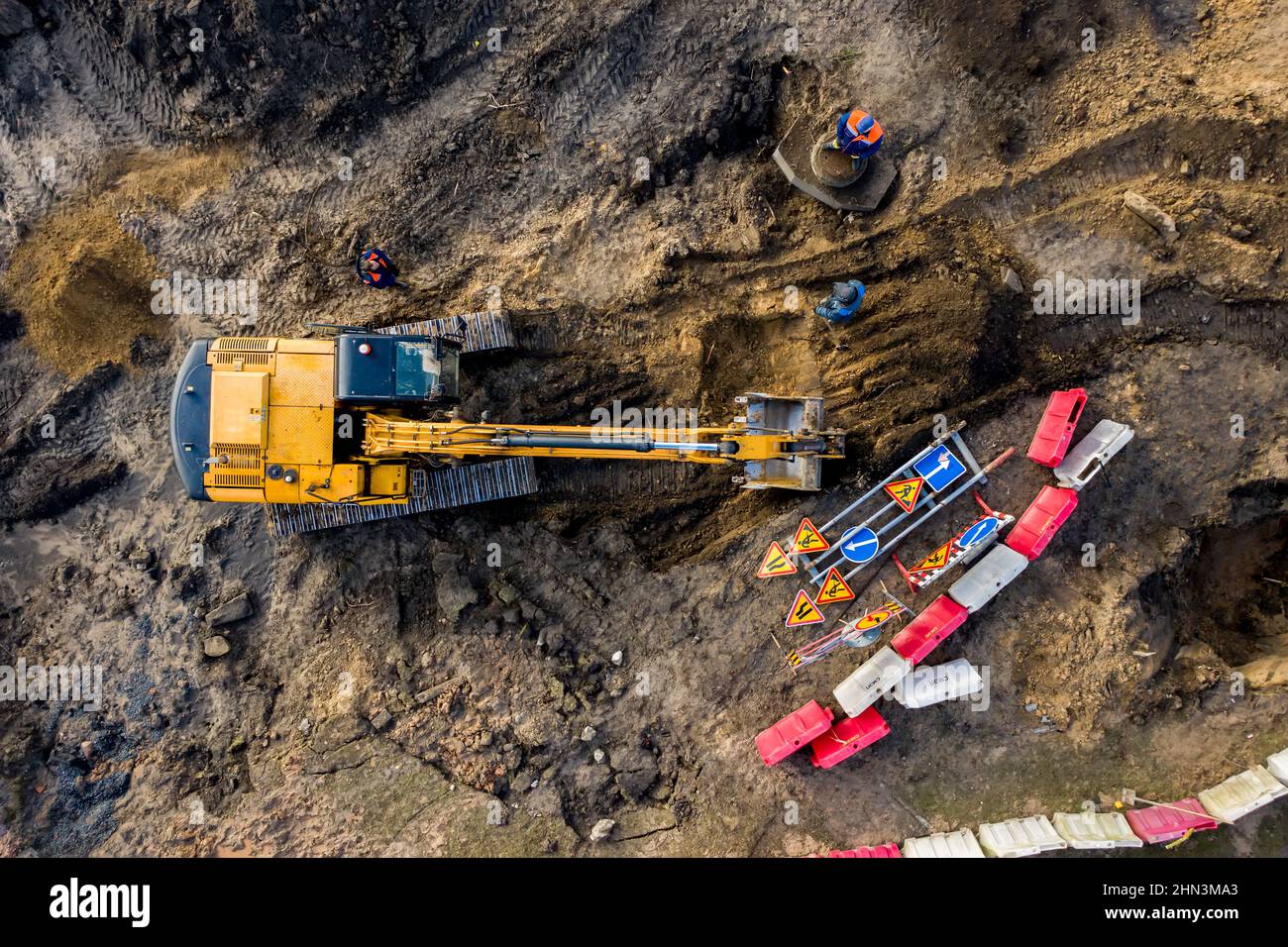 Aerial top view on crawler excavator digging ground for overhaul road ...