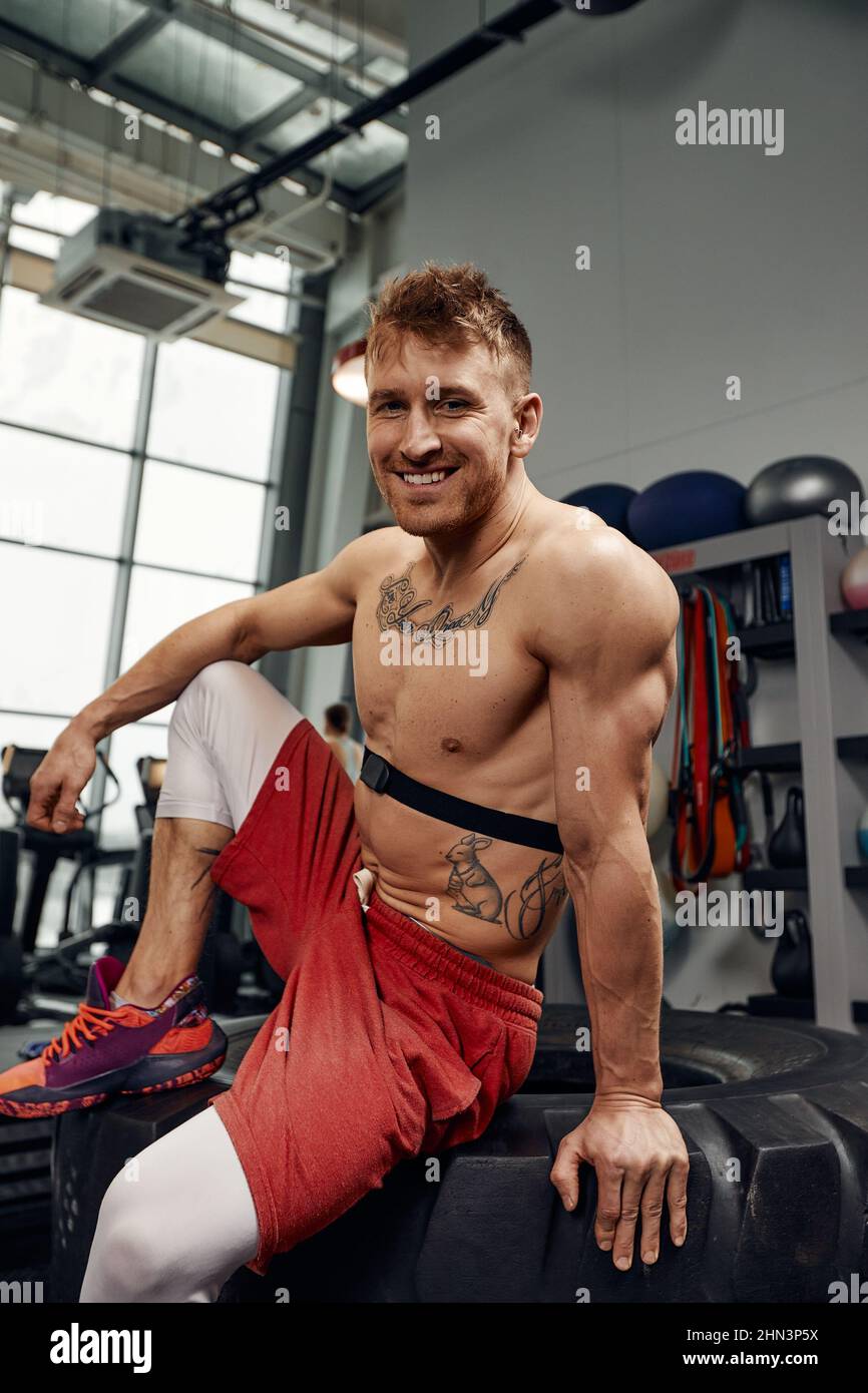 Strength concept. Male athlete using hammer during fitness workout ...