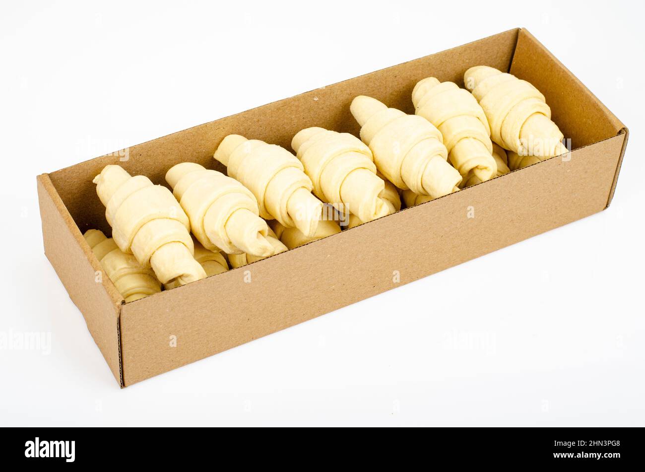 Frozen raw croissants in box on white background. Studio Photo Stock ...