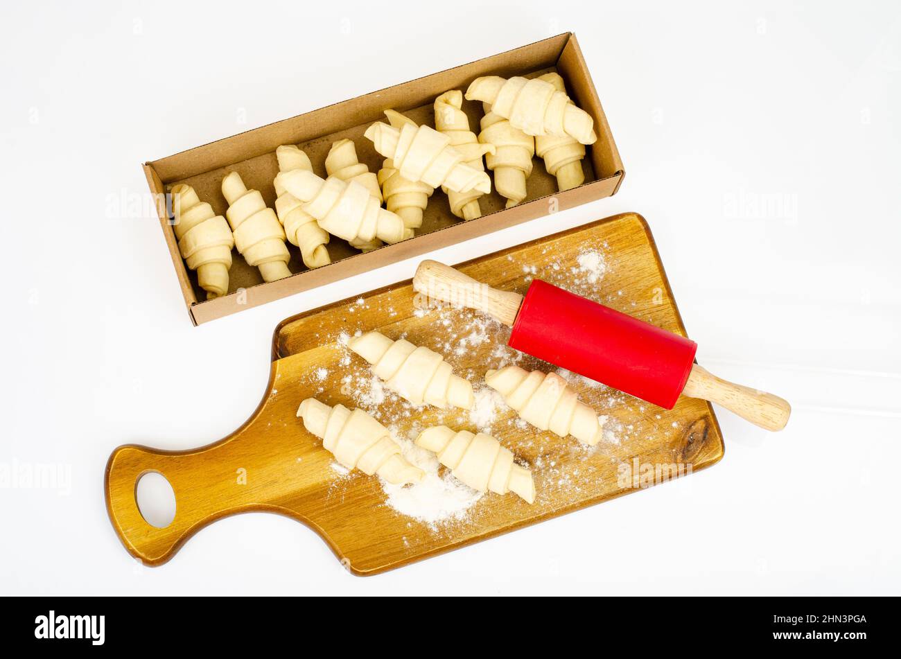 Frozen raw croissants in box on white background. Studio Photo Stock ...