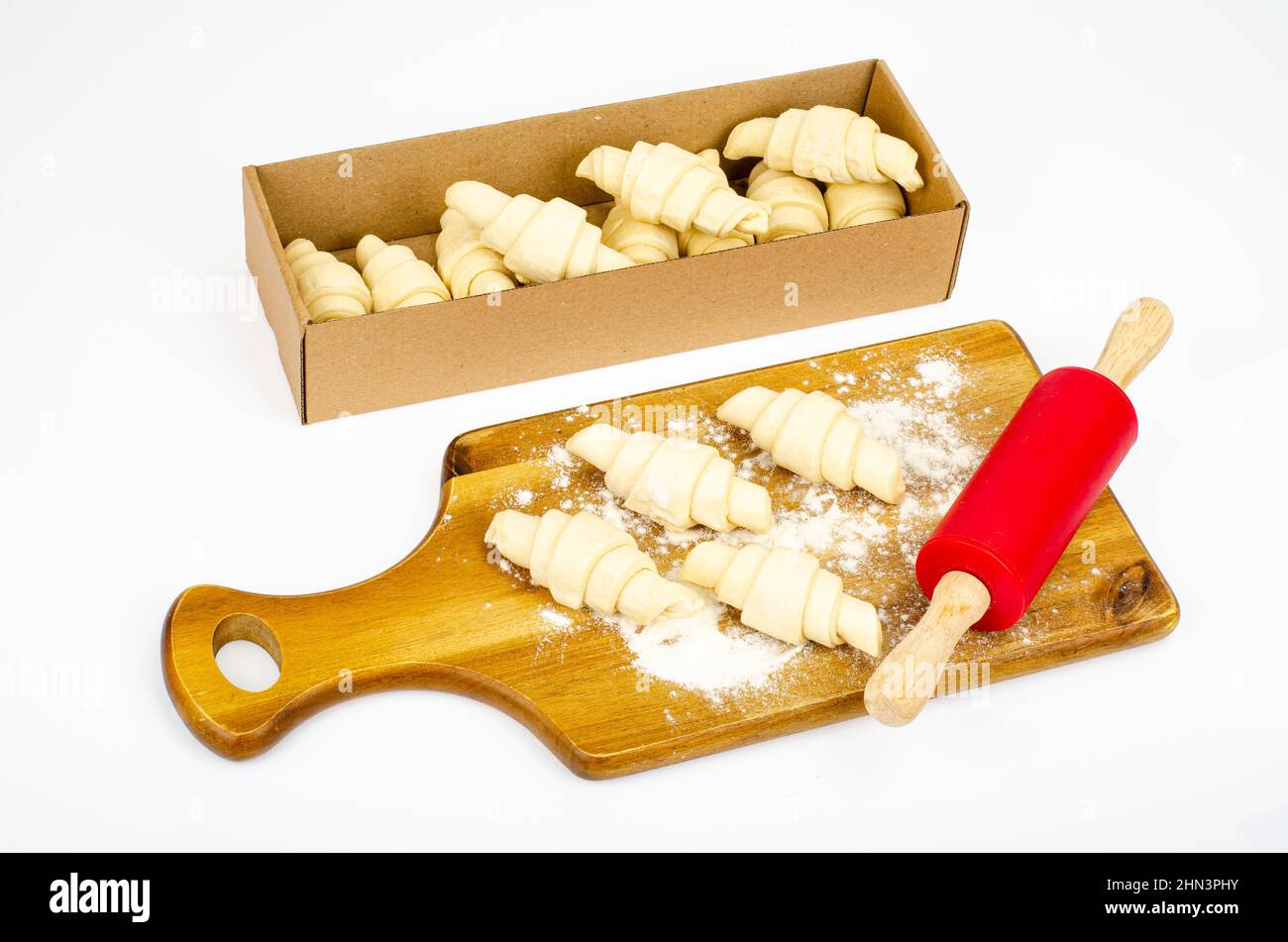 Frozen raw croissants in box on white background. Studio Photo Stock ...
