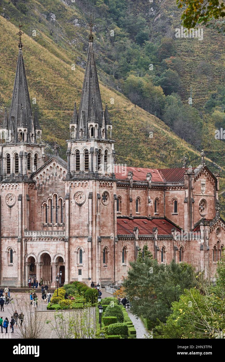 Picturesque red stone basilica and mountains in Covadonga. Asturias ...