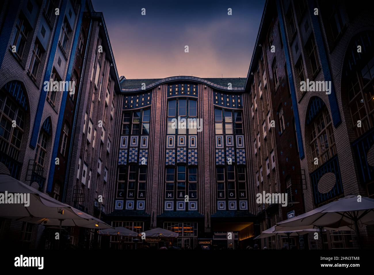 Beautiful exterior view of a huge urban building with arch glass ...