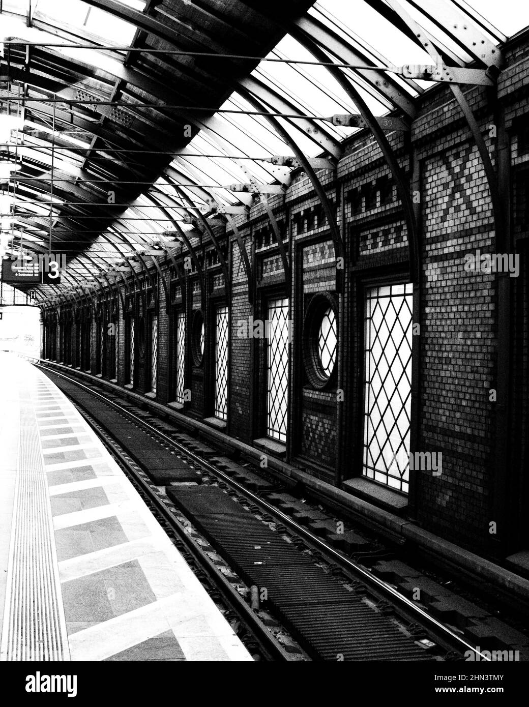 Grayscale view of a modern railway track with modern walls Stock Photo ...