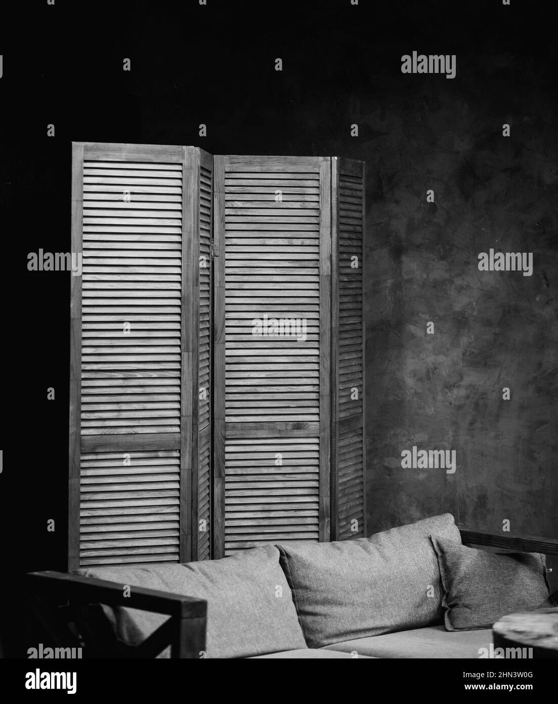 comfortable loft apartment interior with sofa and wooden screen Stock ...