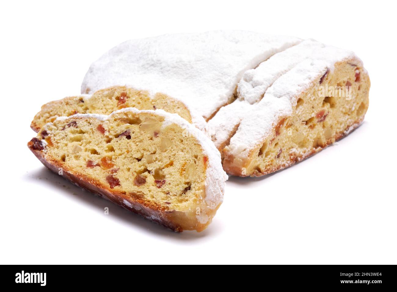 Sliced Traditional Christmas stollen cake with marzipan and dried fruit ...