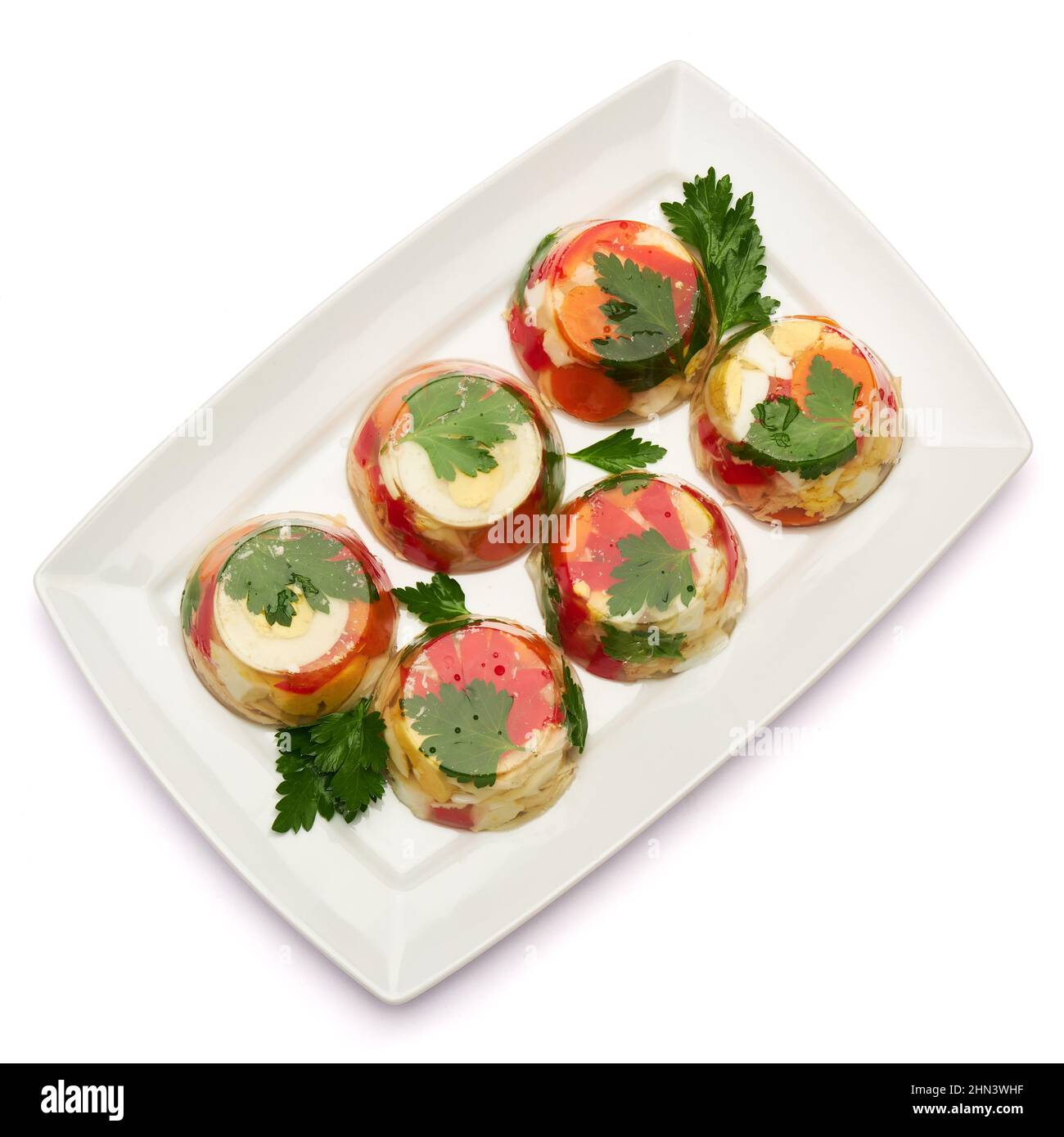 Portion of delicious chicken aspic on a plate isolated on white ...